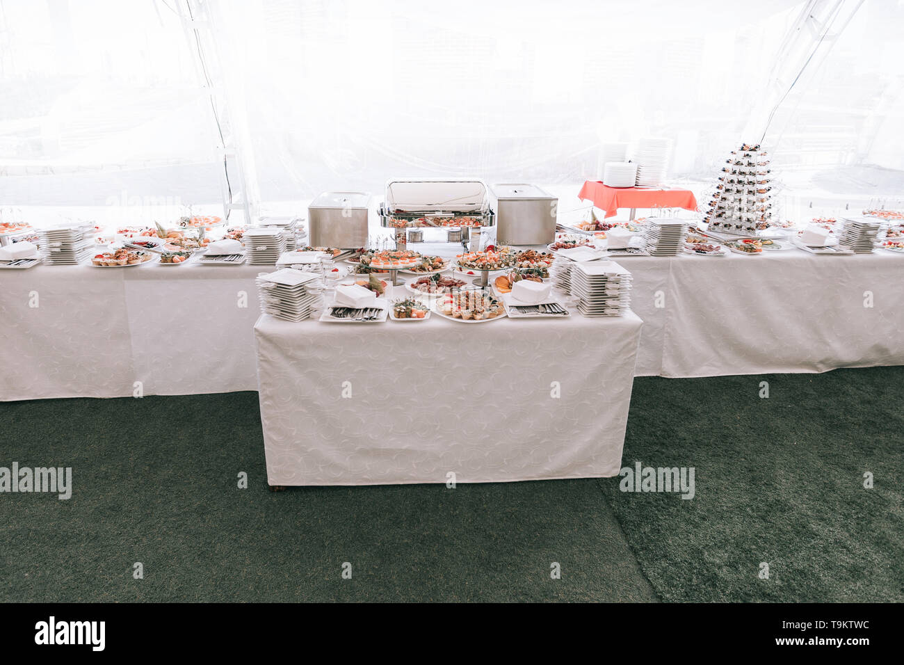 Cutlery and various dishes on the handout table in the modern ...