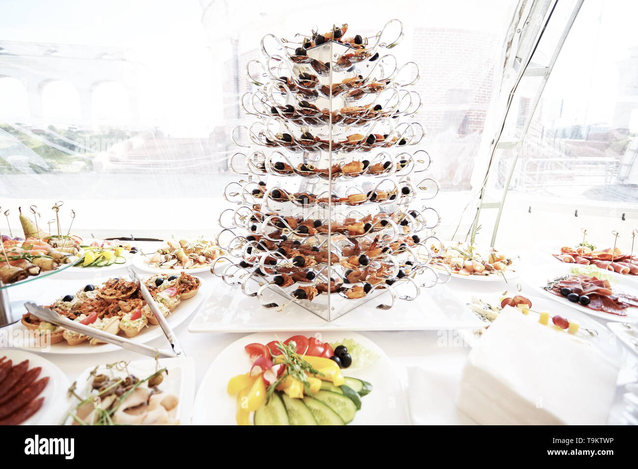 Cutlery and various dishes on the handout table in the modern ...