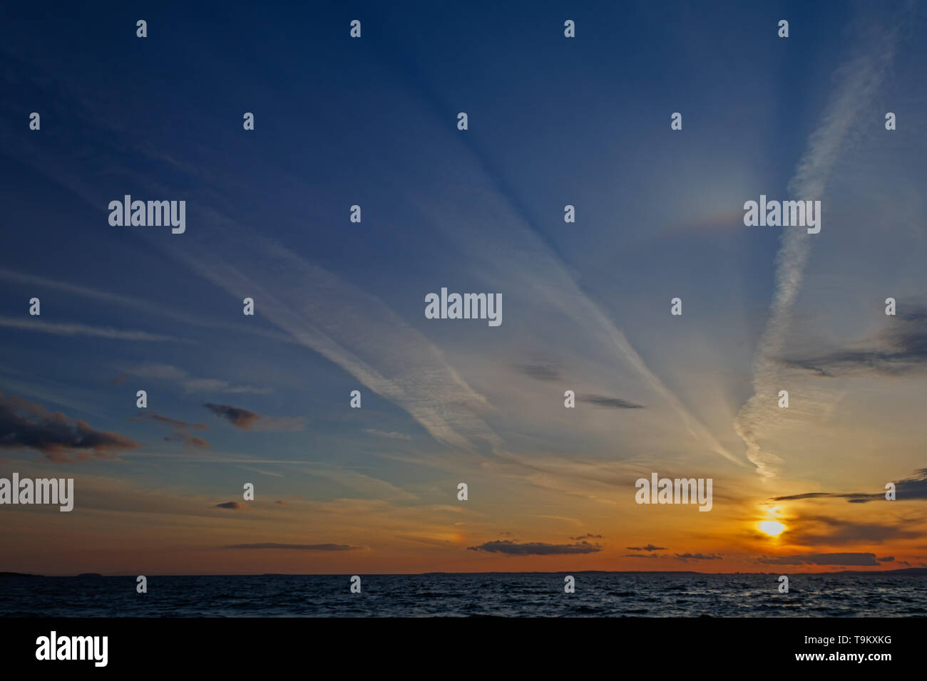 Cloudy sky with setting sun hi-res stock photography and images - Alamy