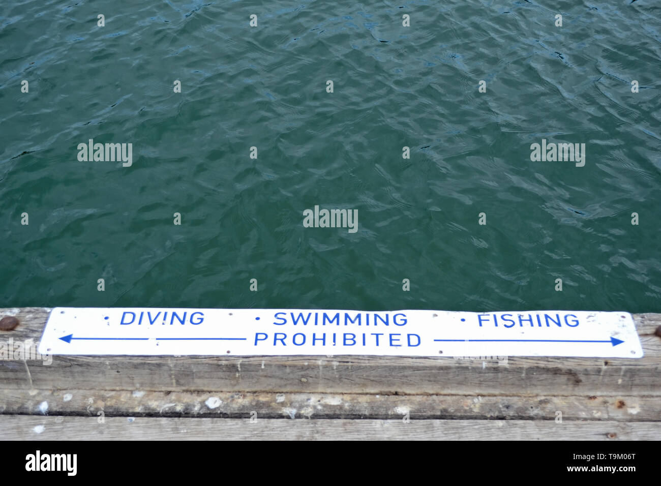 Diving, Swimming And Fishing Prohibited Sign Stock Photo - Alamy