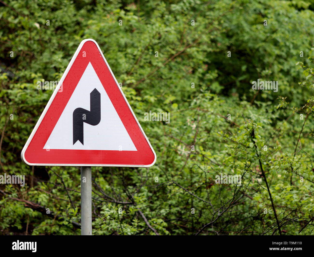 Black And White Road Bend Sign High Resolution Stock Photography and ...
