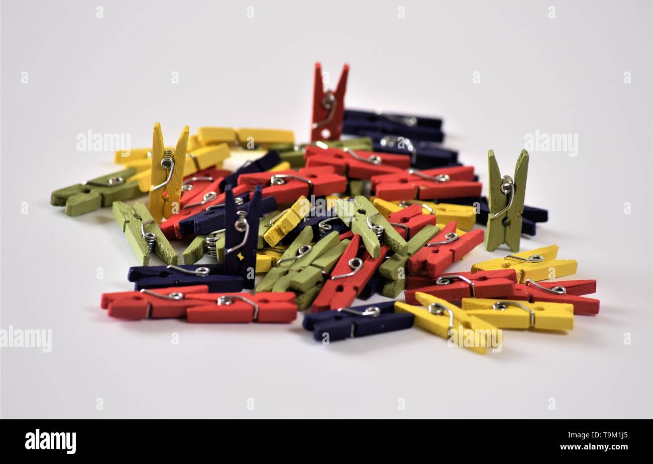 Miniature wooden clips isolated on white background Stock Photo - Alamy