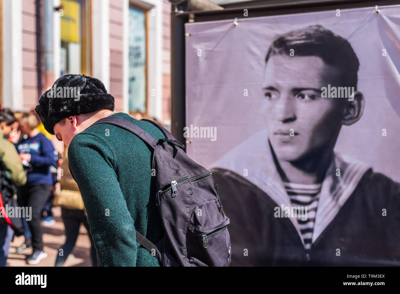 Soviet union hero poster with a young russian guy in front. St ...