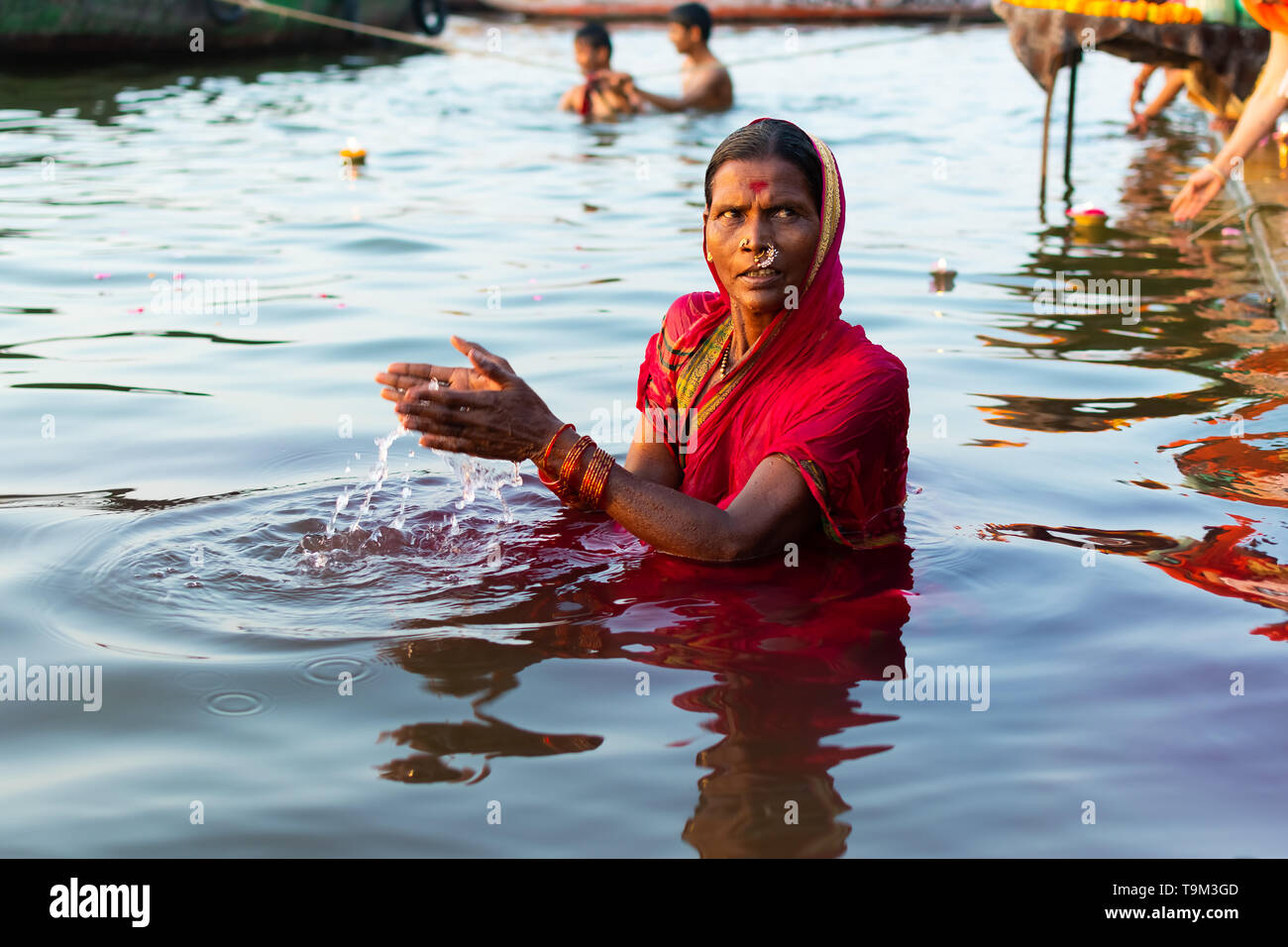 Varanasi, India, 27 Mar 2019 - Hindu woman in sari making offering to ...