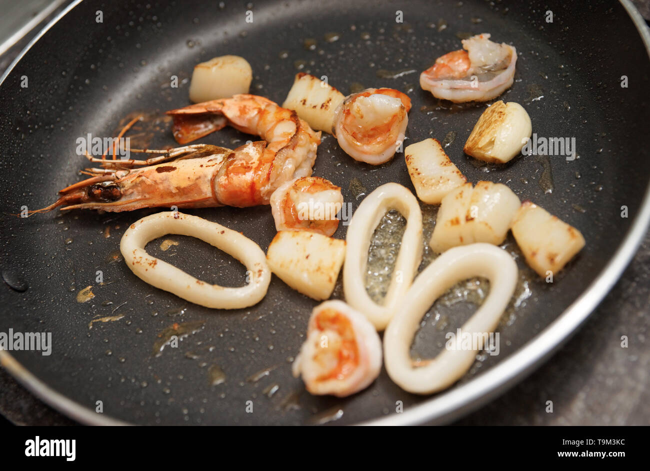 Various seafood on hot pan - healthy food Stock Photo - Alamy