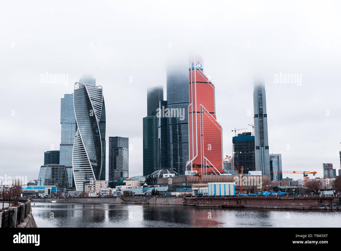 Fog-covered skyscrapers of Moskva City (MIBC) next to river Moscva ...