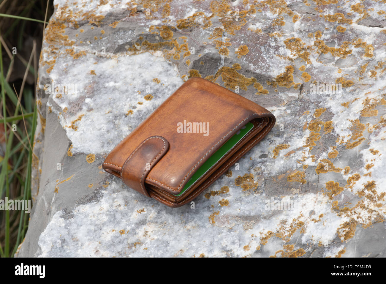 Lost wallet, fallen out of back pocket when sitting on a rock, UK Stock ...