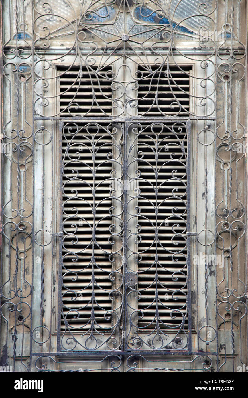 Wooden old window with iron bars Stock Photo - Alamy