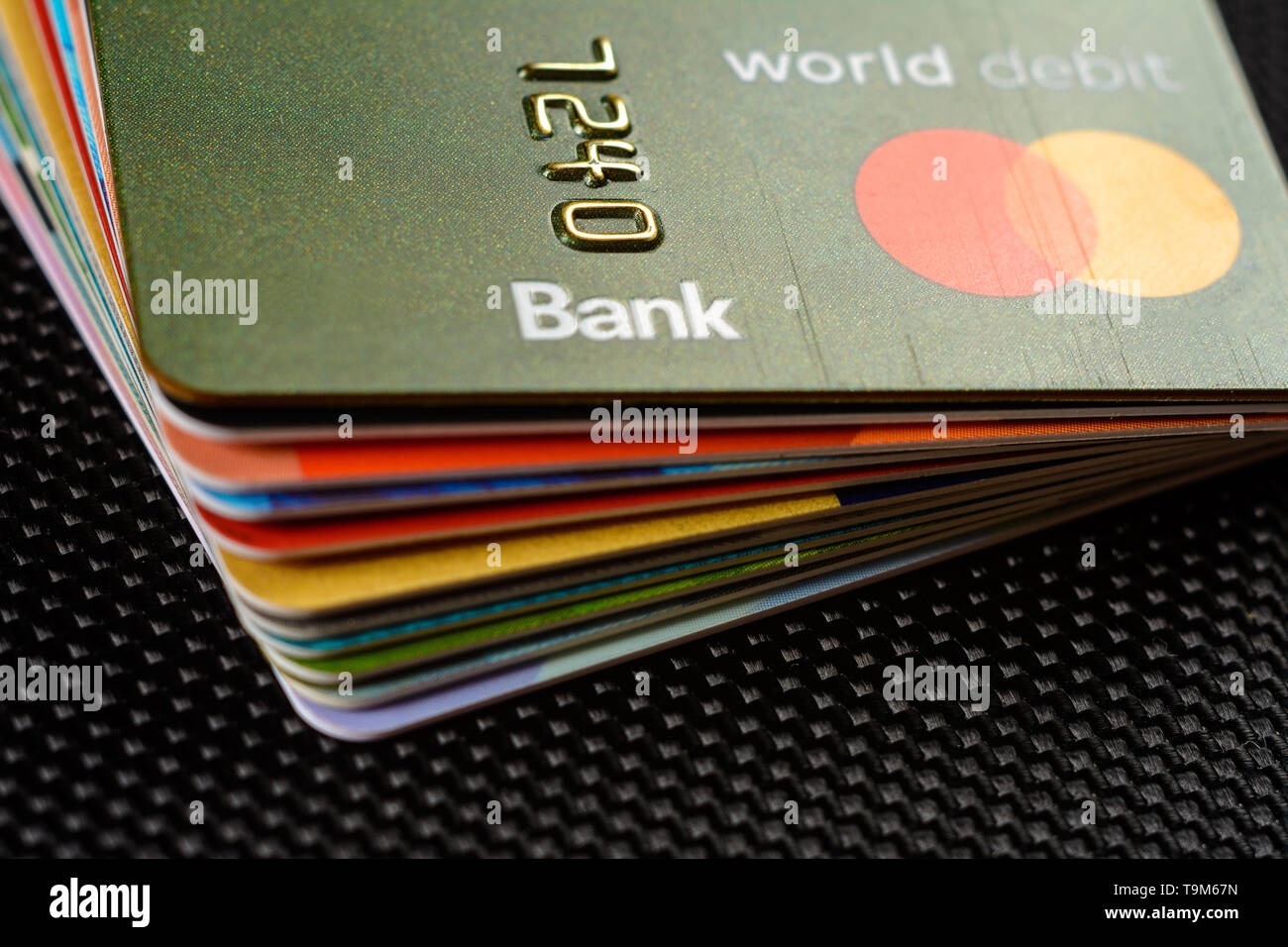 Close-up credit card where the chip is clearly visible on a black ...