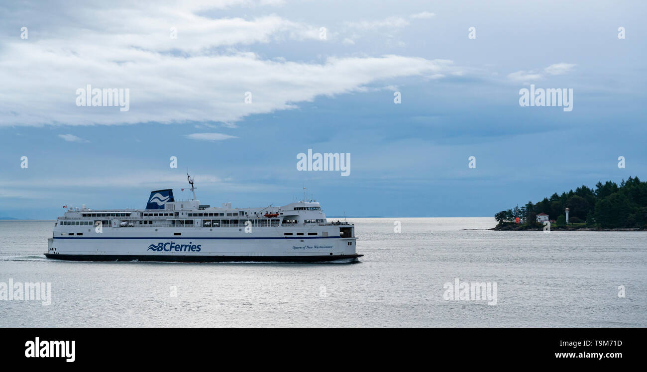 BC Ferries Queen of New Westminster passing the Active Pass Lighthouse ...
