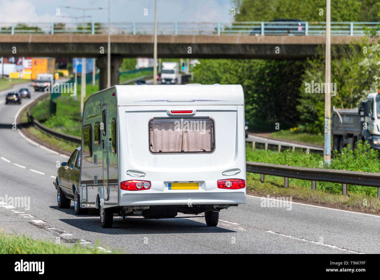 caravan motorhome on uk motorway in fast motion Stock Photo - Alamy