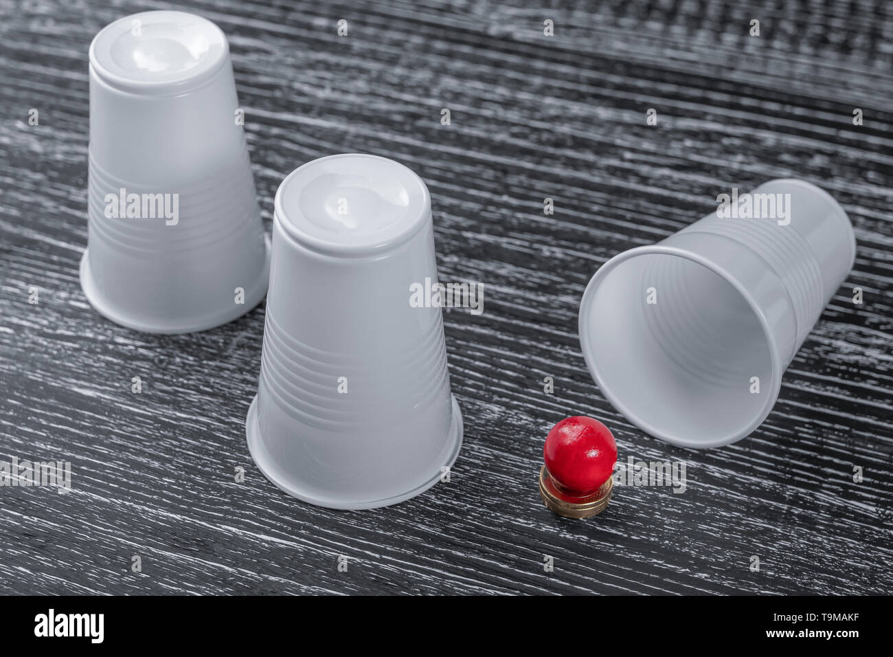 Cup and ball guessing game hi-res stock photography and images - Alamy