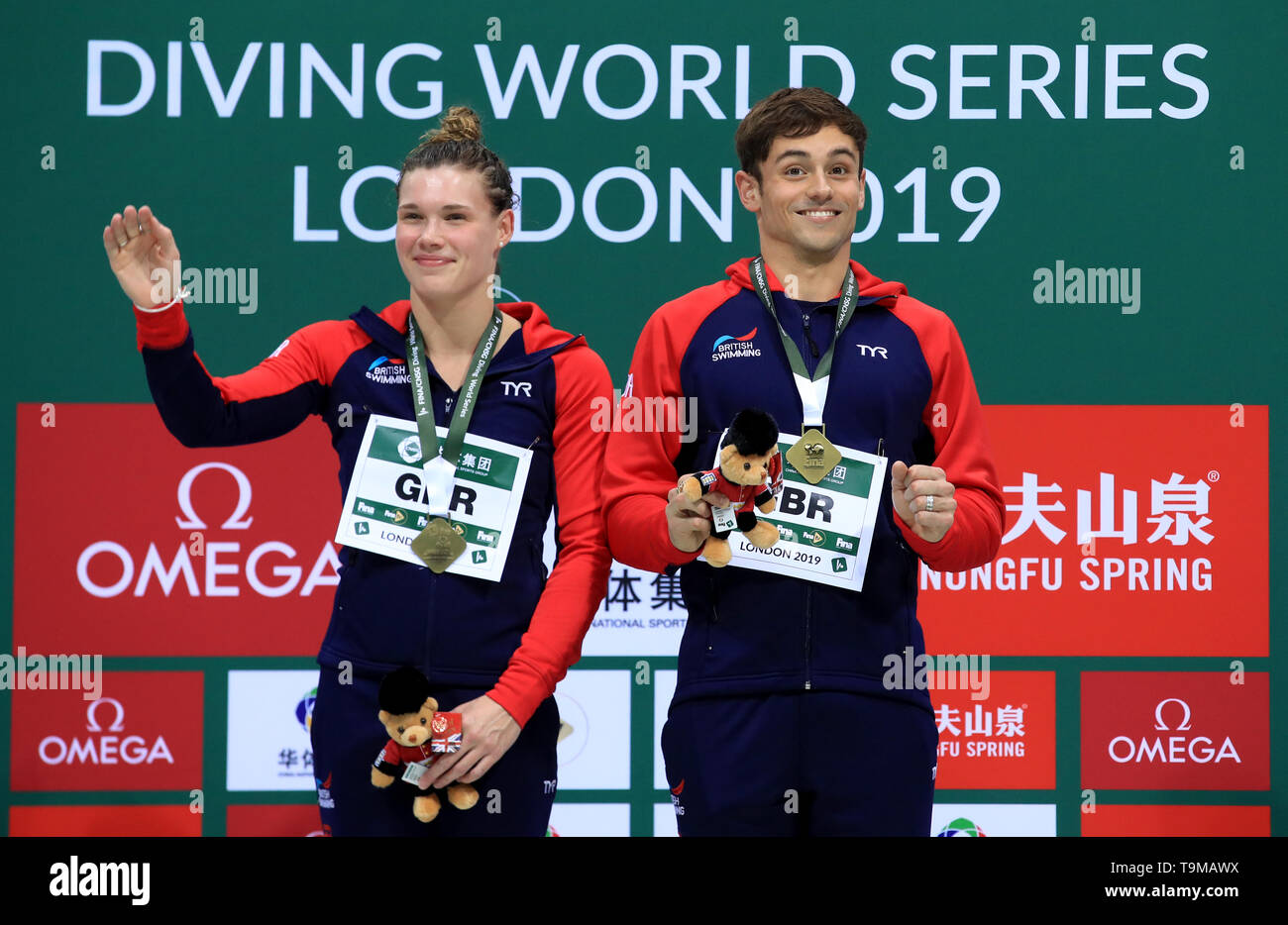 Great Britain's Thomas Daley and Grace Reid on the podium after they ...