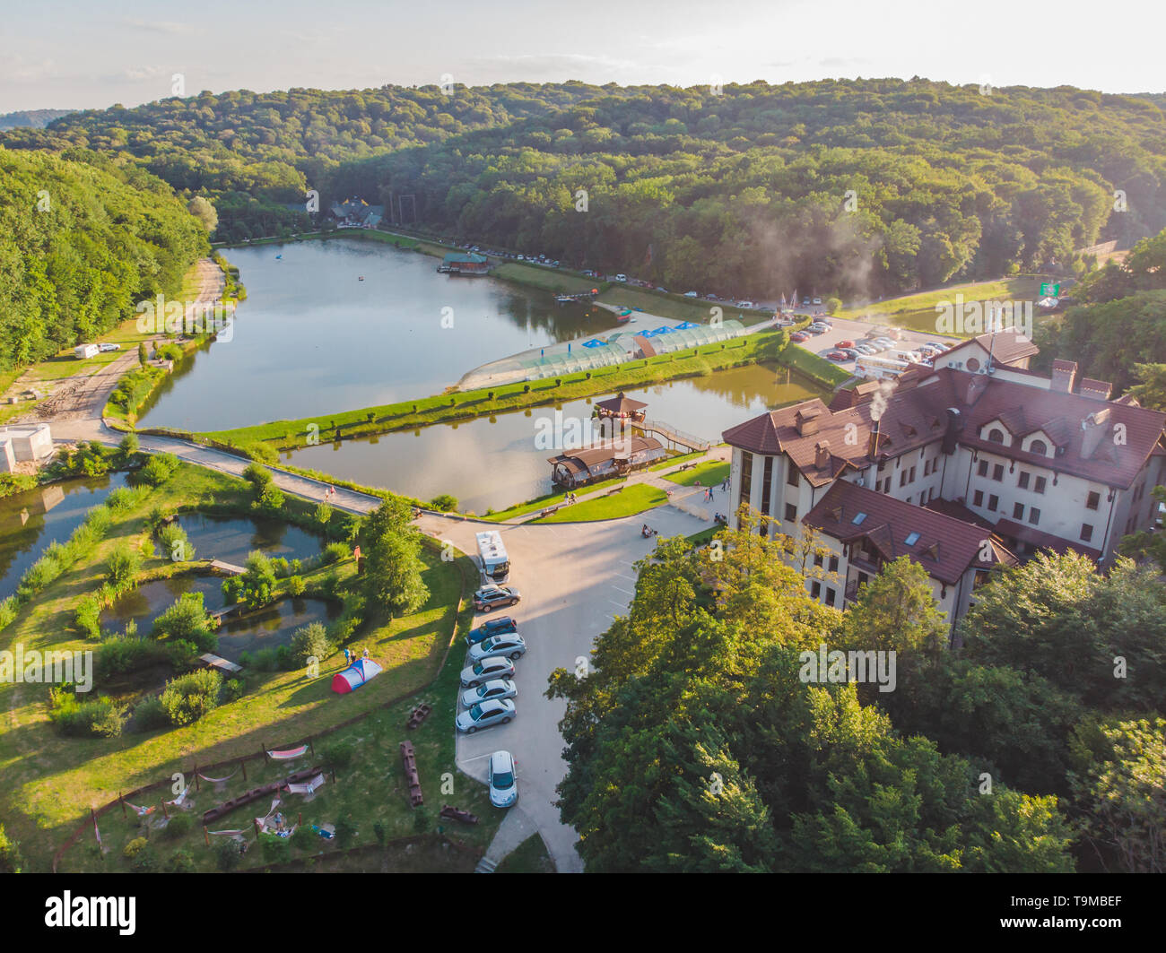 aerial view of resort near lake forest around. sunny evening Stock ...