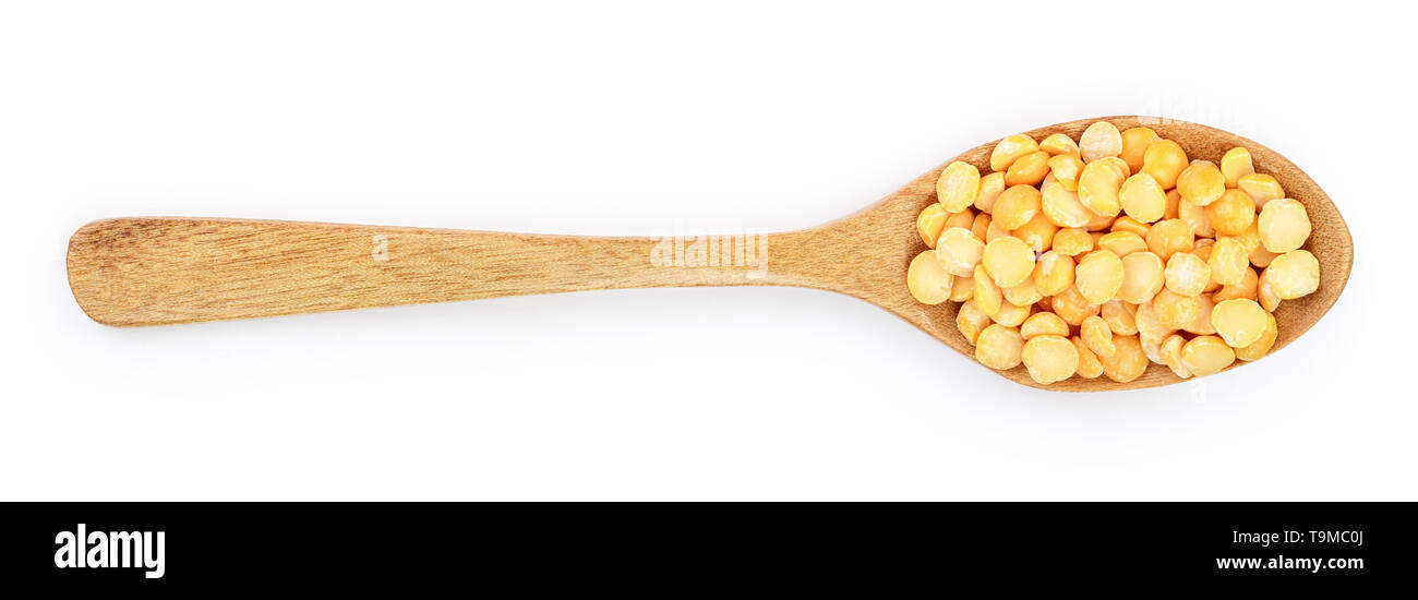 yellow split peas in a wooden spoon isolated on white background. Top ...