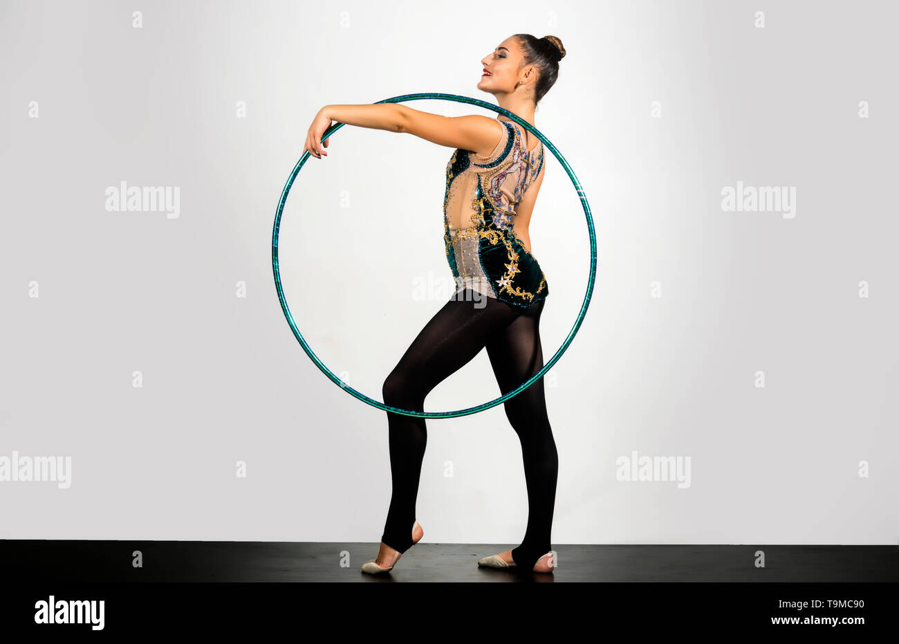 gymnastic ring at athlete woman. gymnastic ring with flexible woman on ...