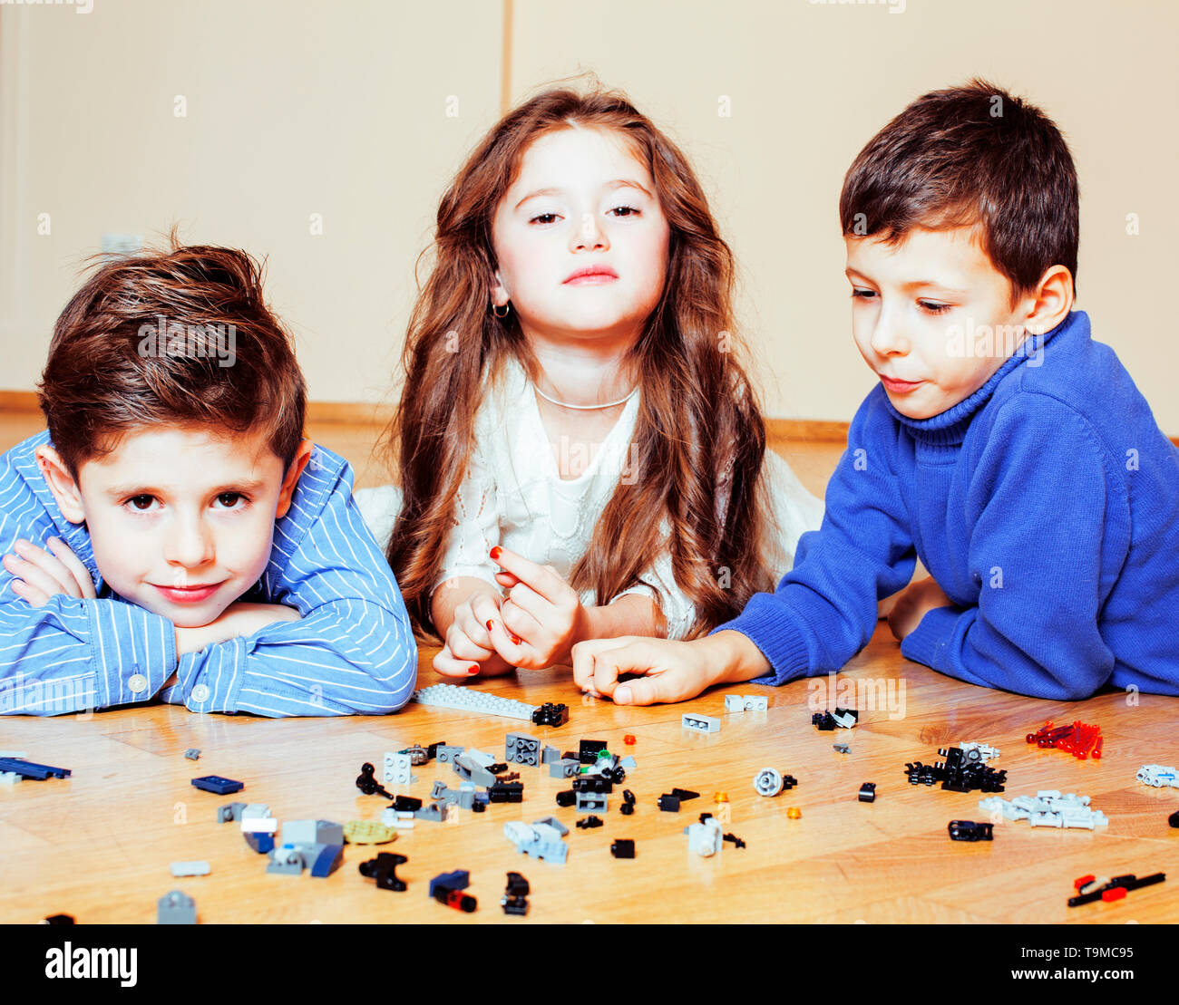 funny cute children playing toys at home, boys and girl smiling, first ...