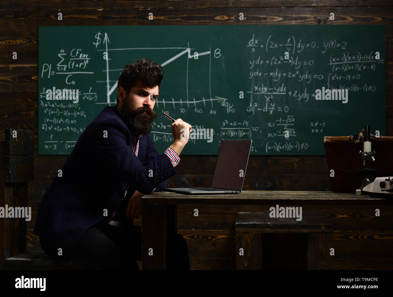 Professor and school student at classroom in school. planning. Workshop ...