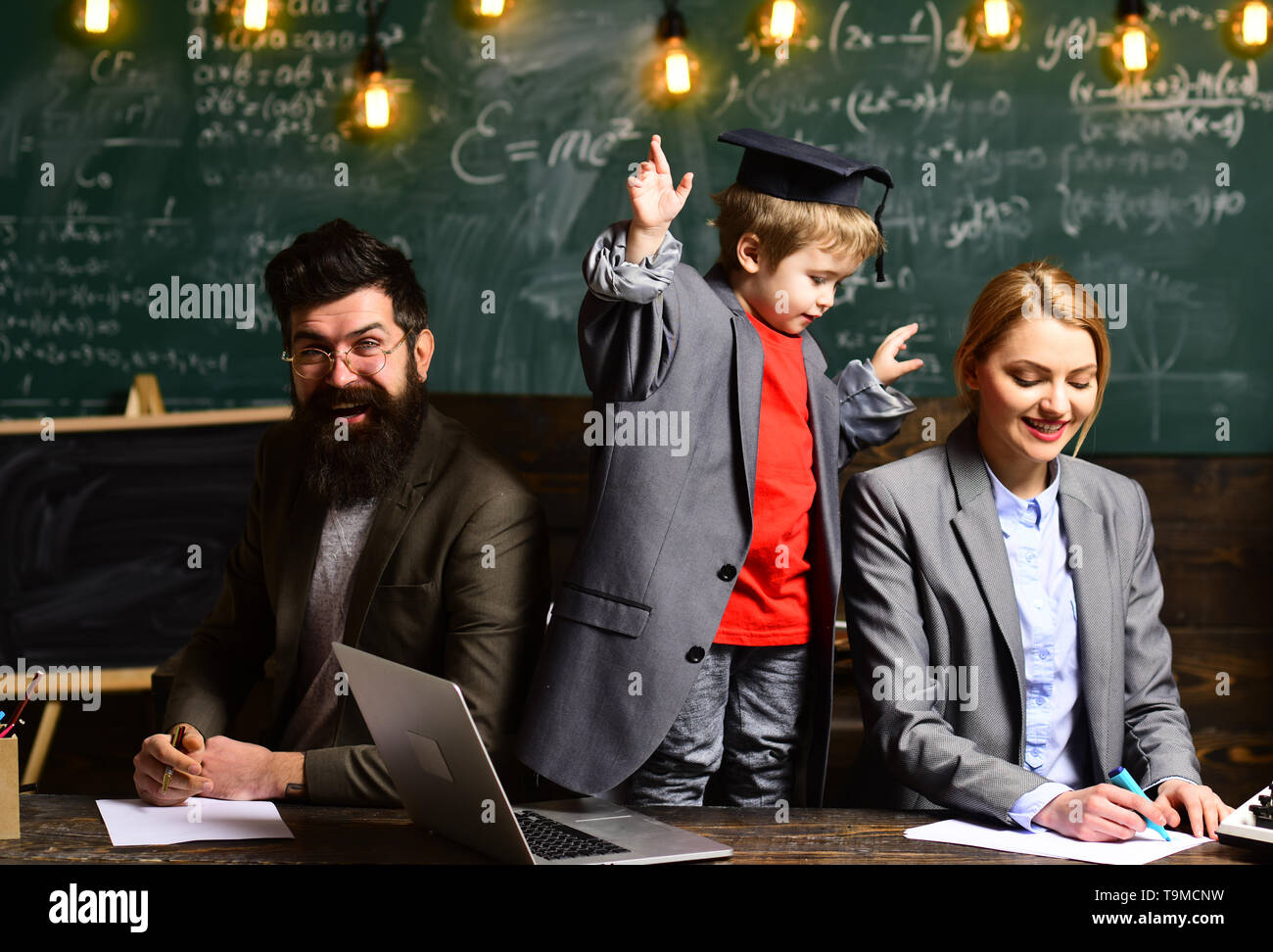 happy child is learning. E-Learning concept with student holding his ...