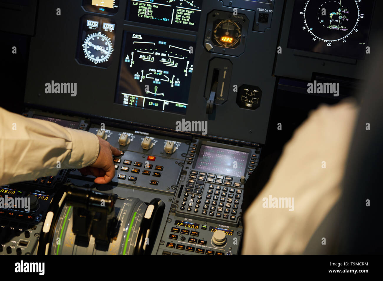 Aviators checking engine systems on flight deck Stock Photo - Alamy