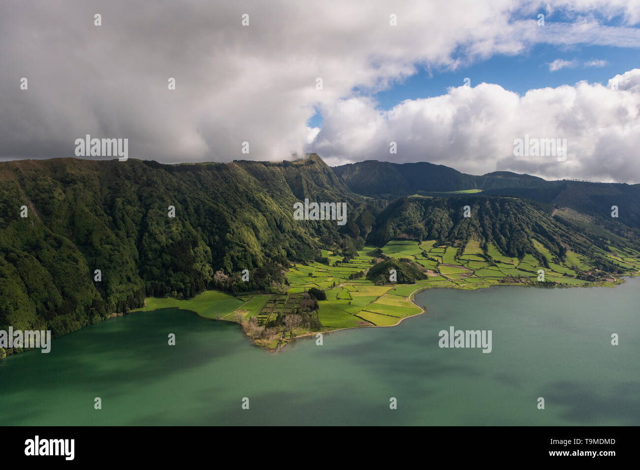 aerial landscape of the impressive volcanic crater with Lagoa Azul at ...