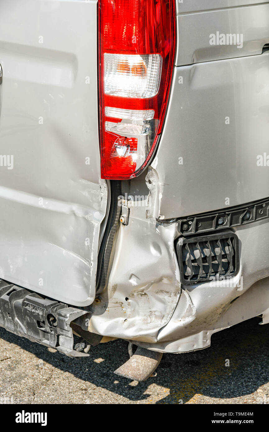 Damaged rear end and lights of a ban after an accident Stock Photo - Alamy