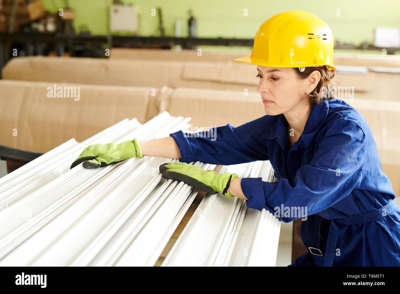 Female Worker Sorting Material Stock Photo - Alamy