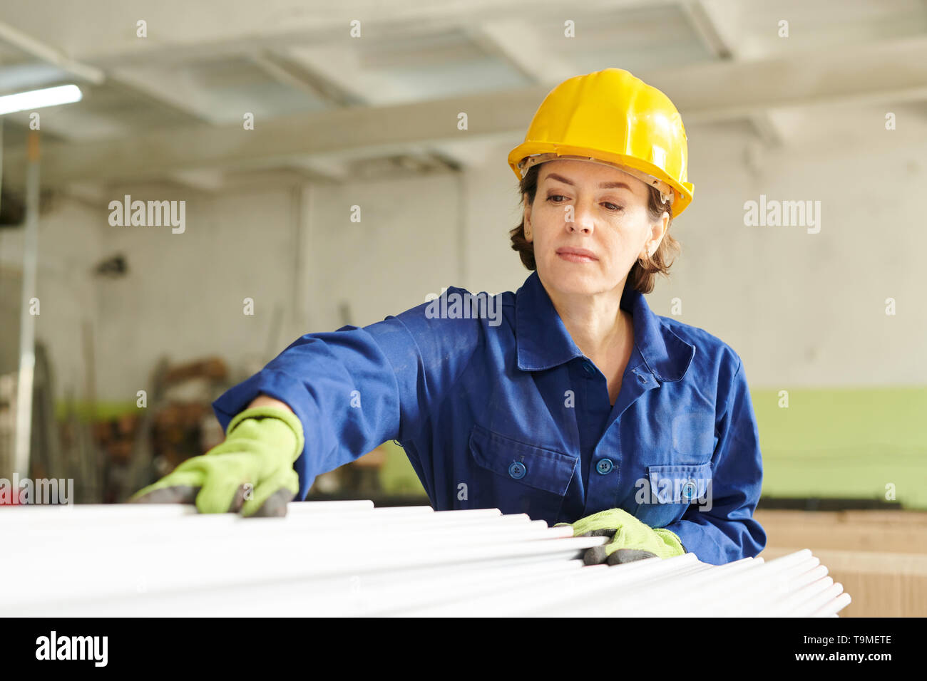Female Worker at Production Factory Stock Photo - Alamy