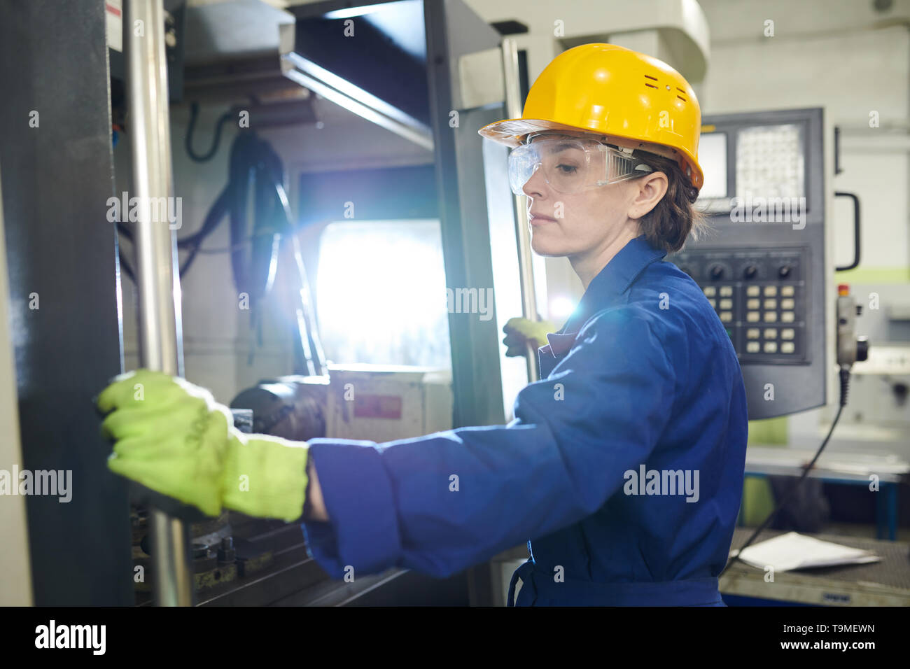 Woman Working at Plant Stock Photo - Alamy