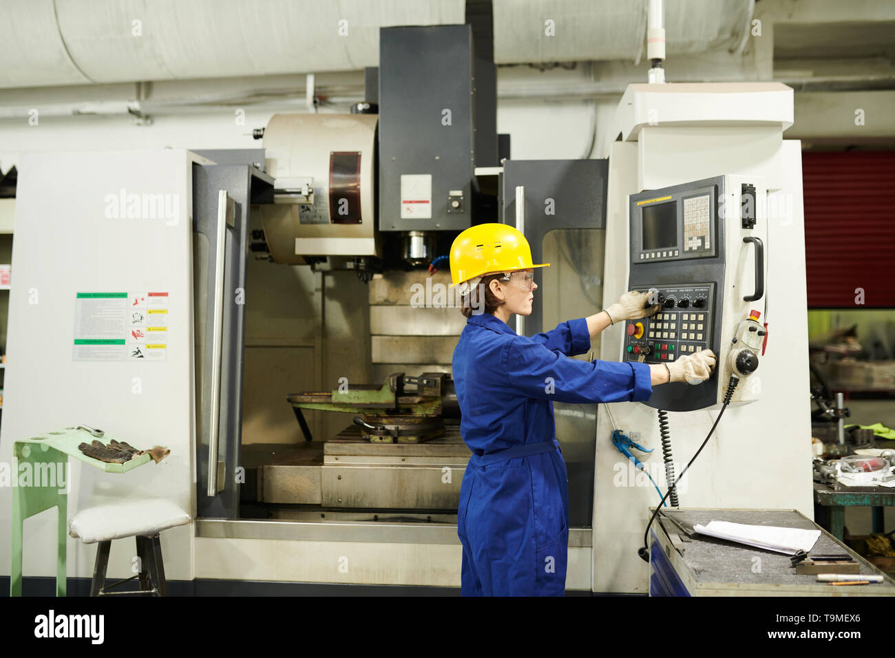 Worker Using Machine Units Stock Photo - Alamy