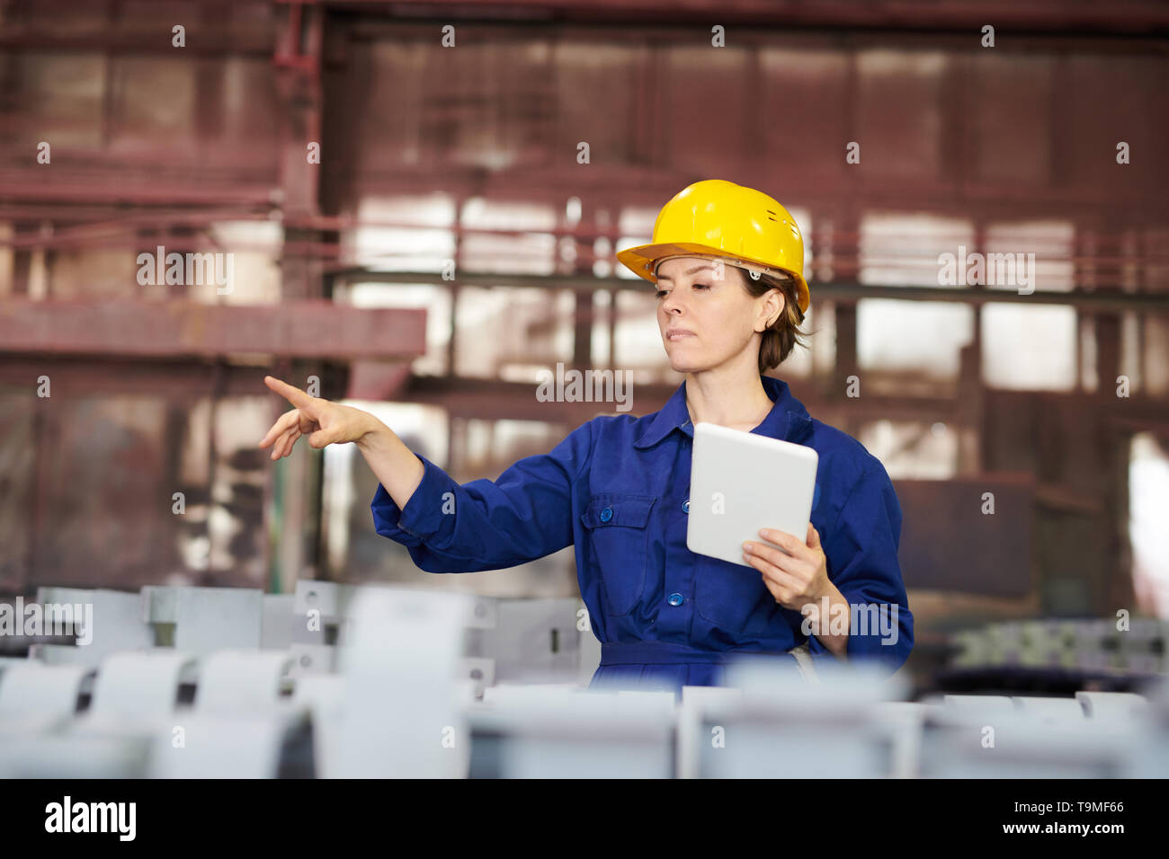 Female Worker Managing Production Stock Photo - Alamy
