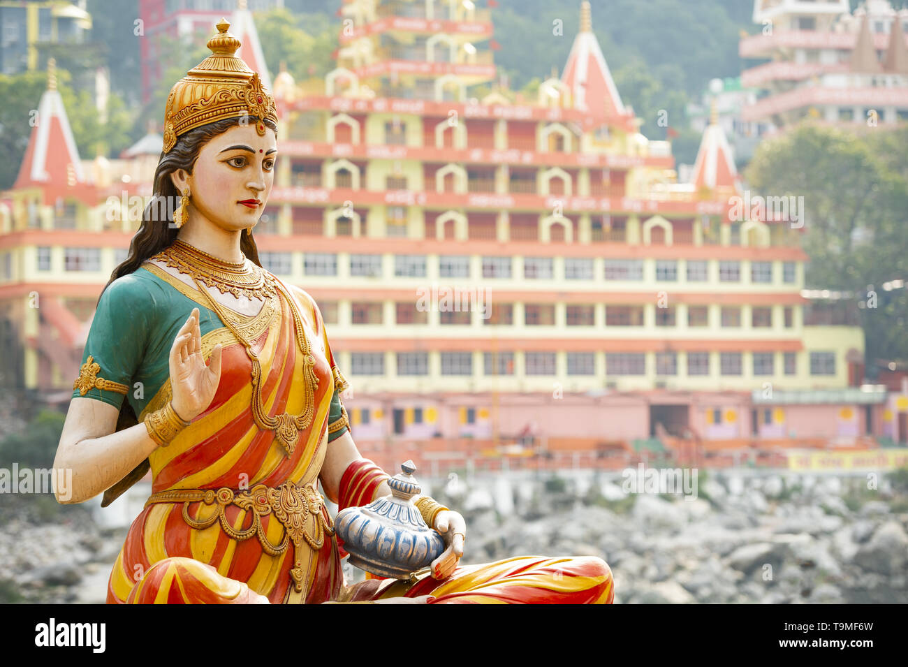 Stunning view of the statue of sitting Goddess Parvati on the riverbank ...