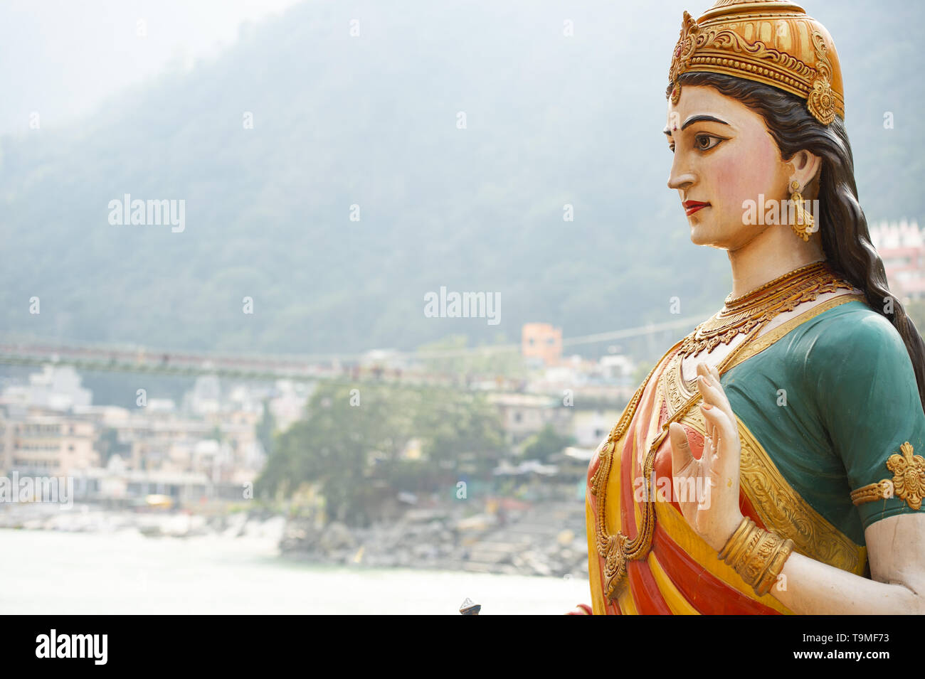 Close-up view of the statue of sitting Goddess Parvati on the riverbank ...