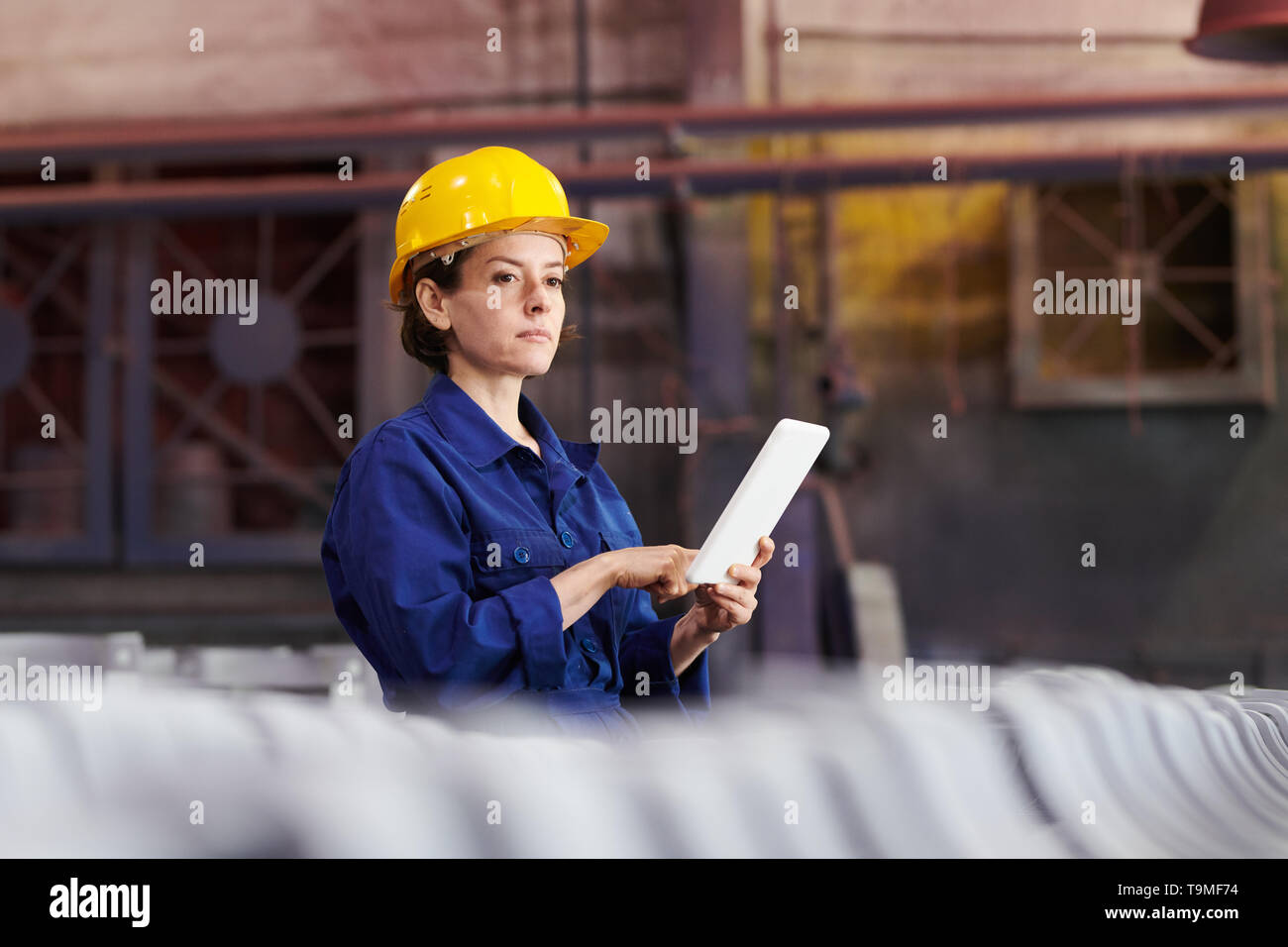 Strong Woman Managing Production Stock Photo - Alamy