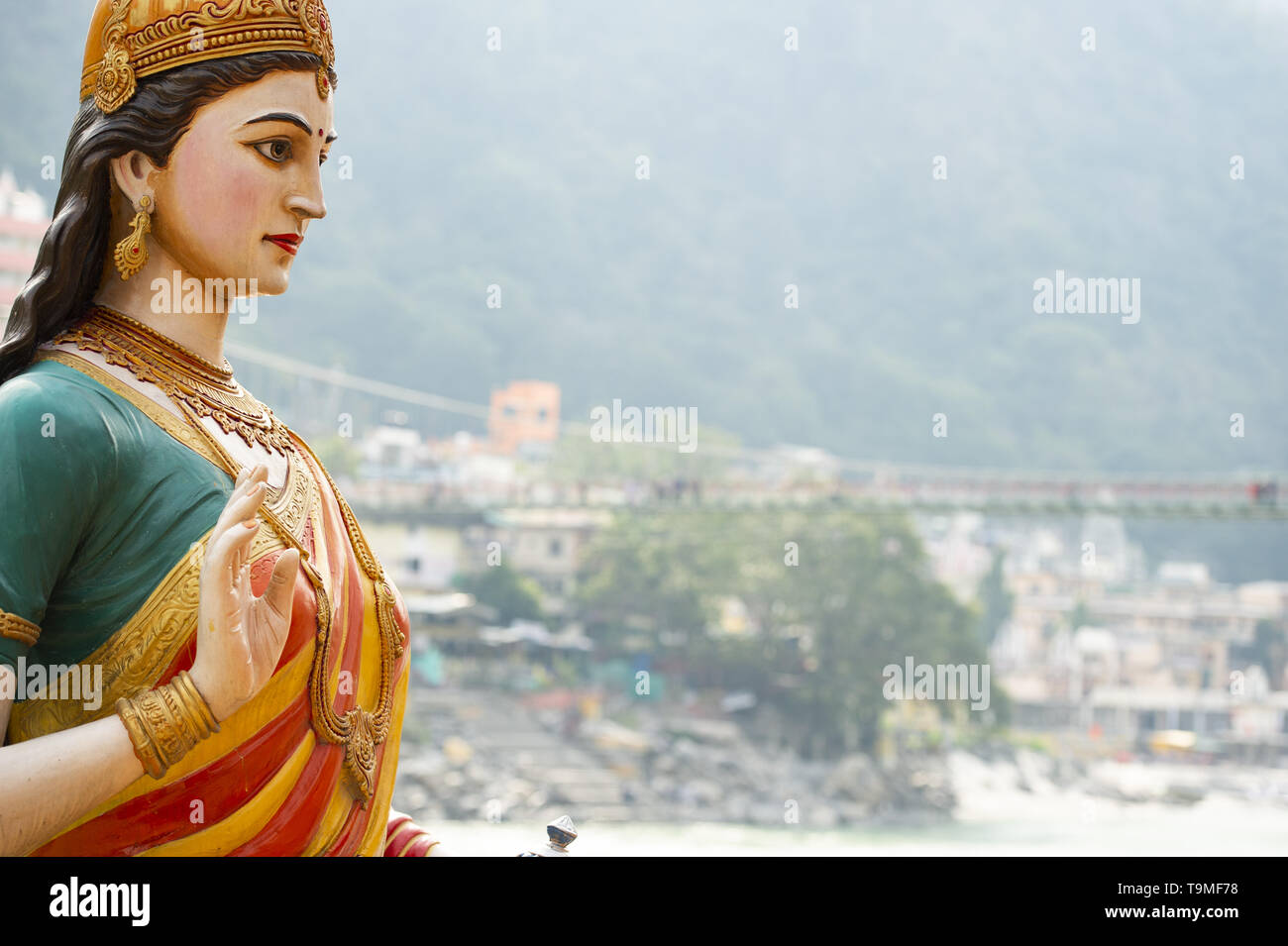 Close-up view of the statue of sitting Goddess Parvati on the riverbank ...
