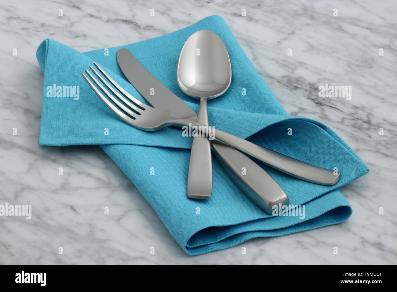 trendy and beautiful silverware set styled on linen double hemstitch ...