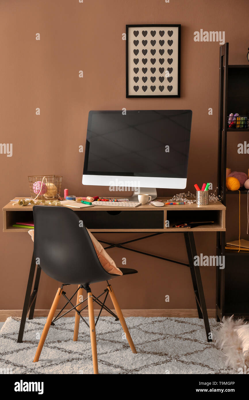 Modern workplace of designer in interior of room Stock Photo - Alamy