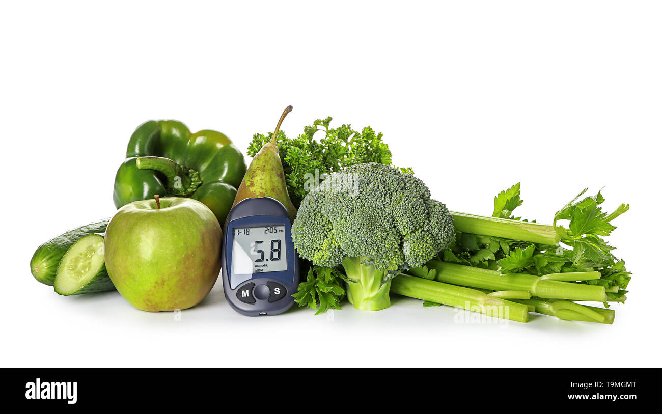 Digital glucometer with healthy food on white background. Diabetes diet ...