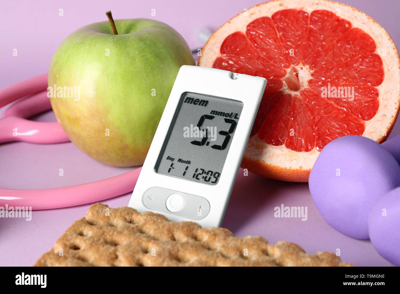 Digital glucometer with healthy food on color background. Diabetes diet ...
