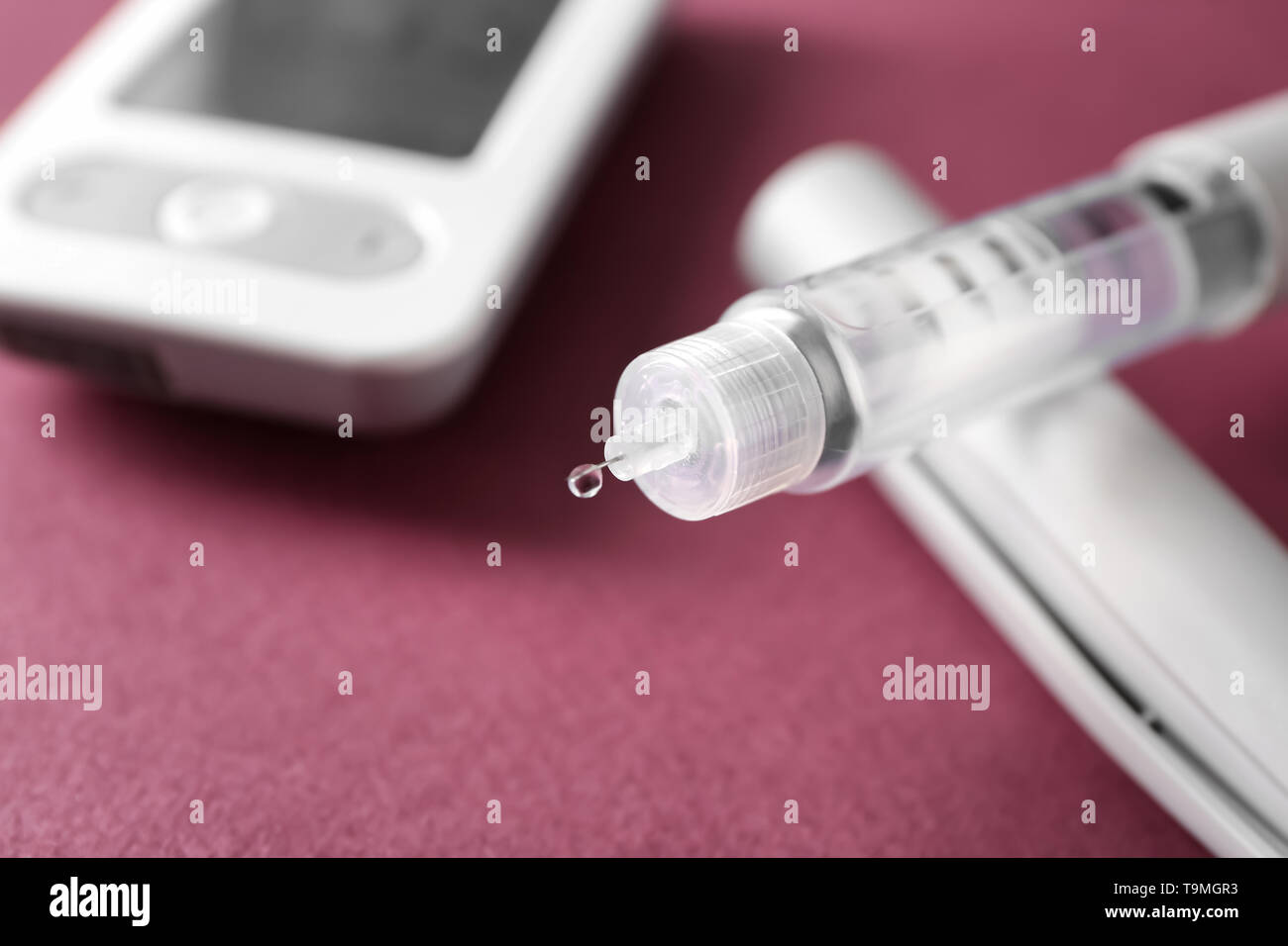 Syringe for insulin injections on color background, closeup. Diabetes ...