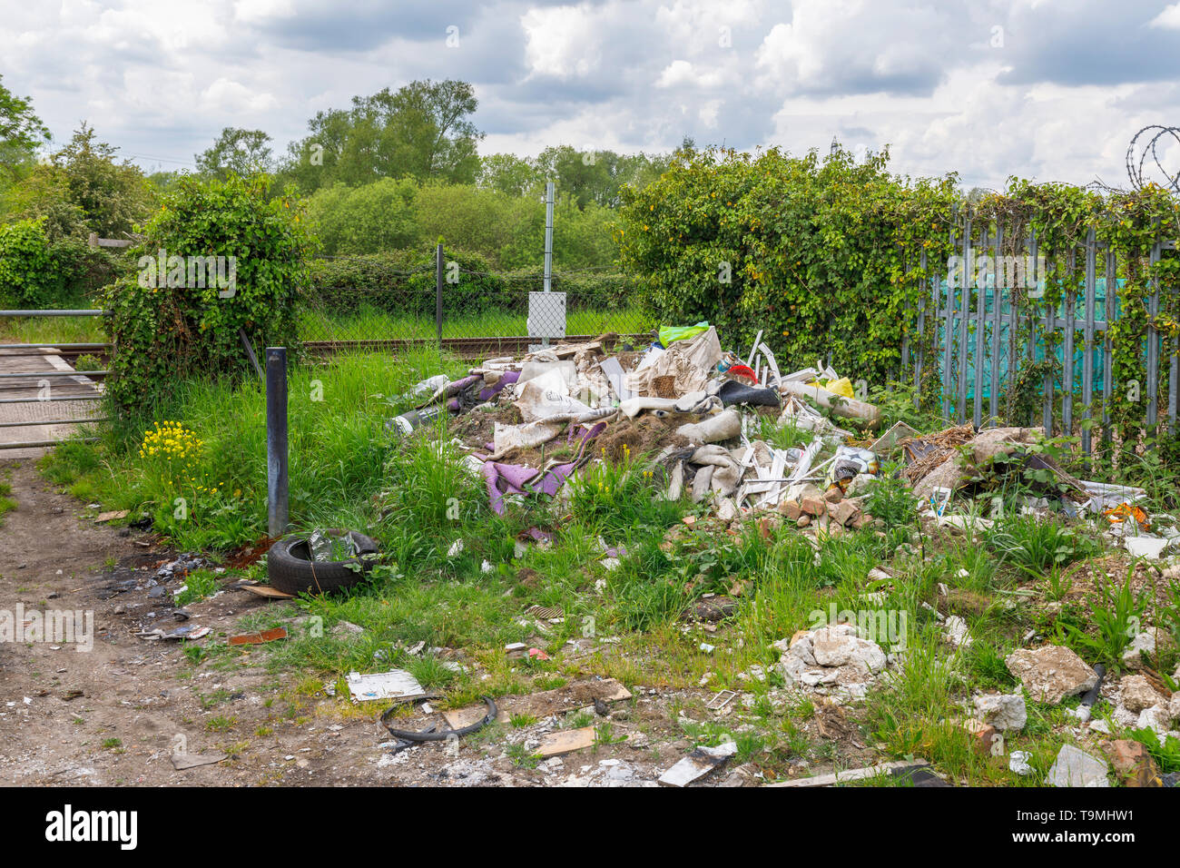 A pile of rubbish, rubble and trash from illegal fly tipping dumped ...