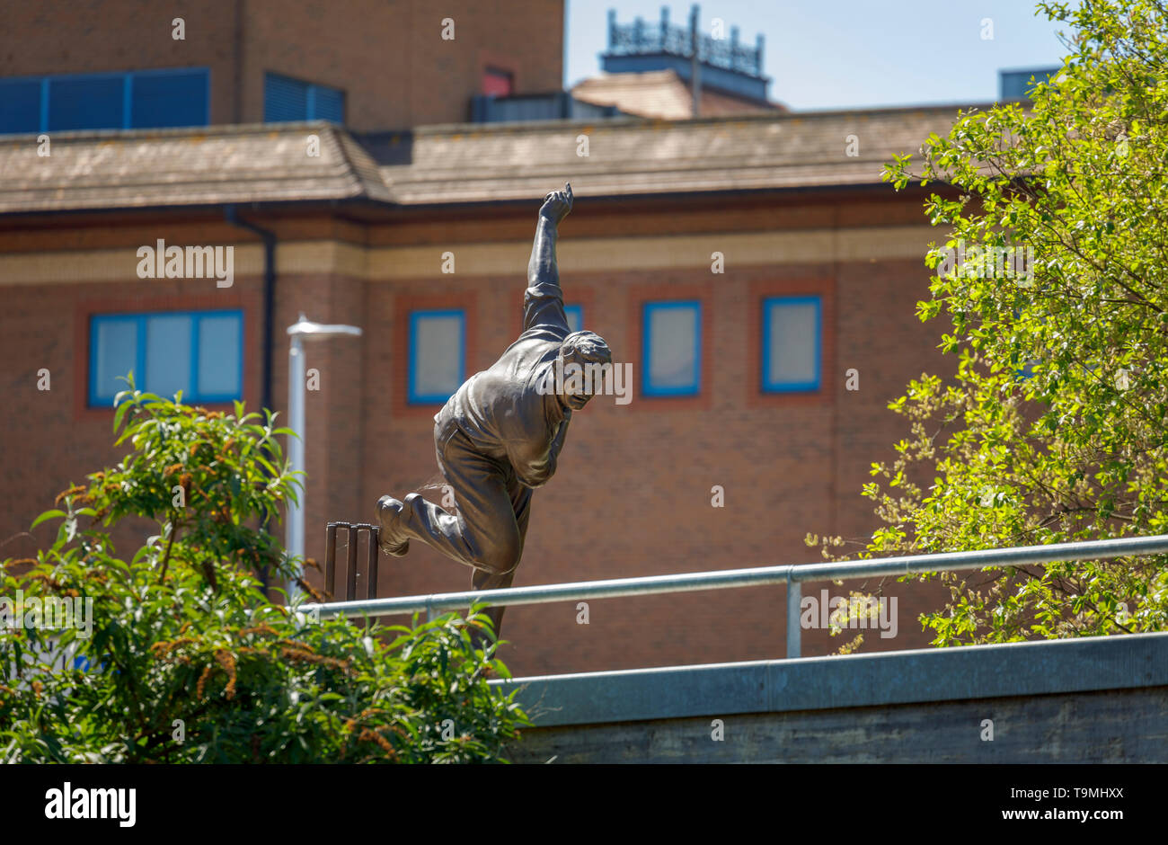 Bronze statue of cricket player Sir Alec Bedser on Bedser Bridge, a ...