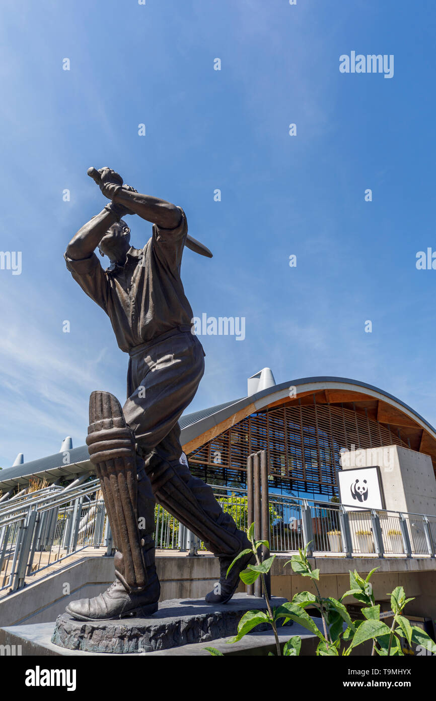 Bronze statue of cricket player Eric Bedser on Bedser Bridge, a ...