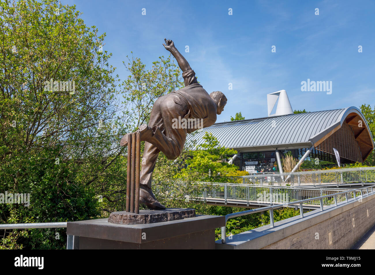 Bronze statue of cricket player Sir Alec Bedser on Bedser Bridge, a ...