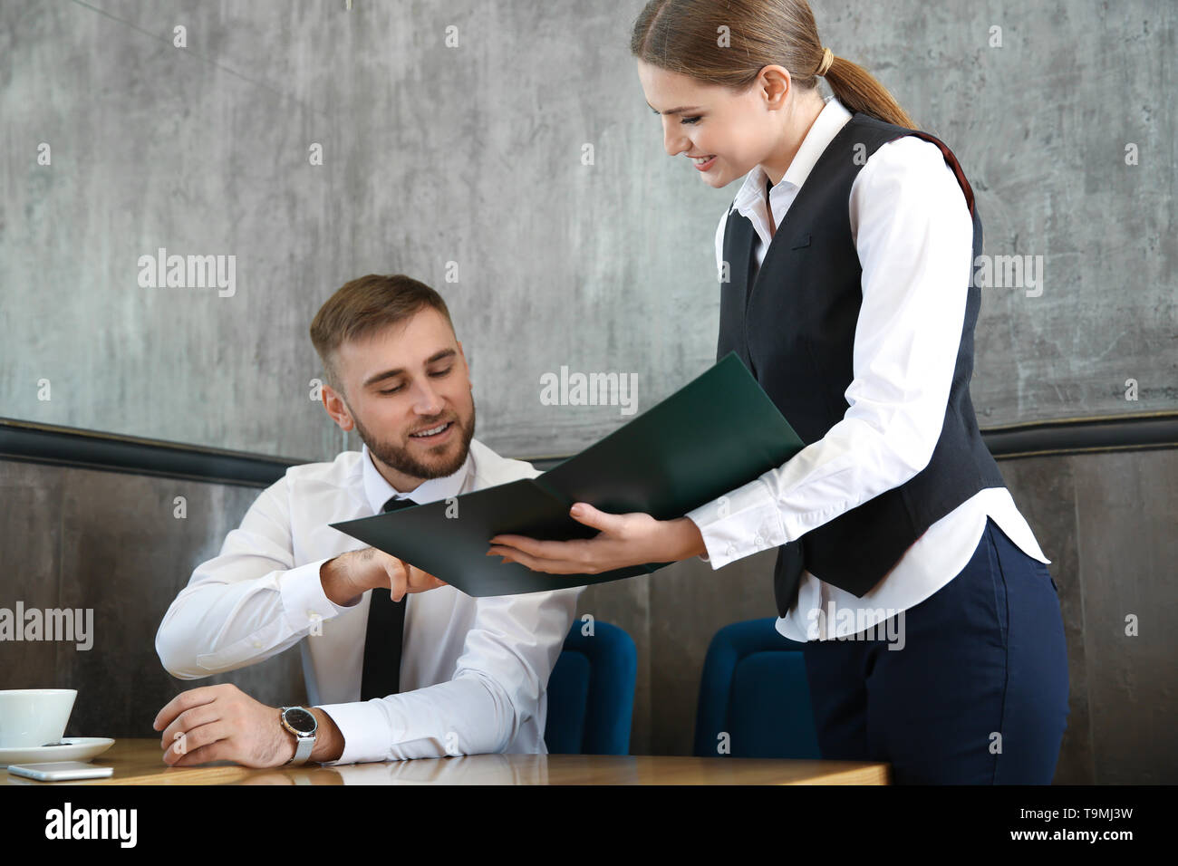 Female customer read menu hi-res stock photography and images - Alamy