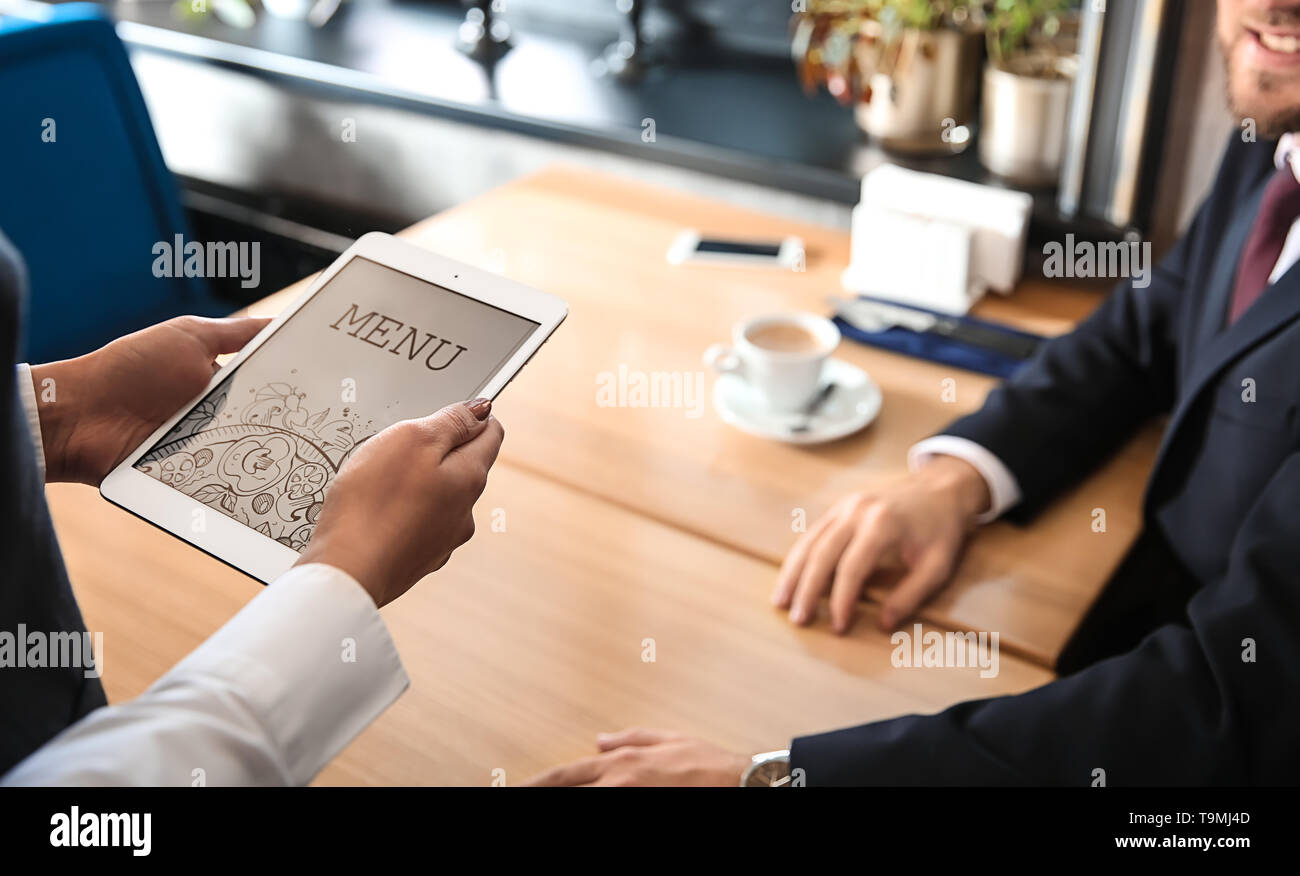 Waitress with menu hi-res stock photography and images - Alamy