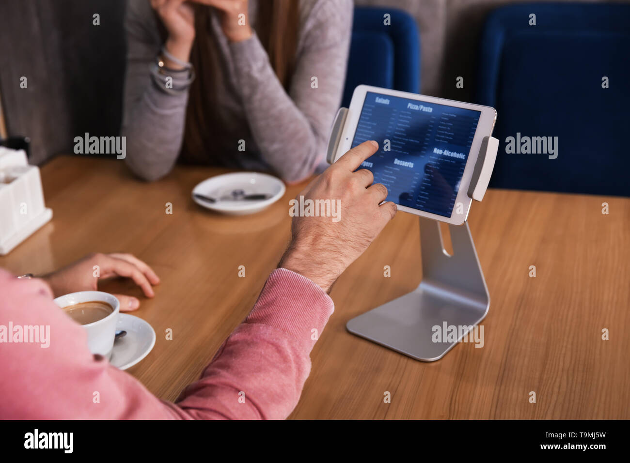 Female customer read menu hi-res stock photography and images - Alamy