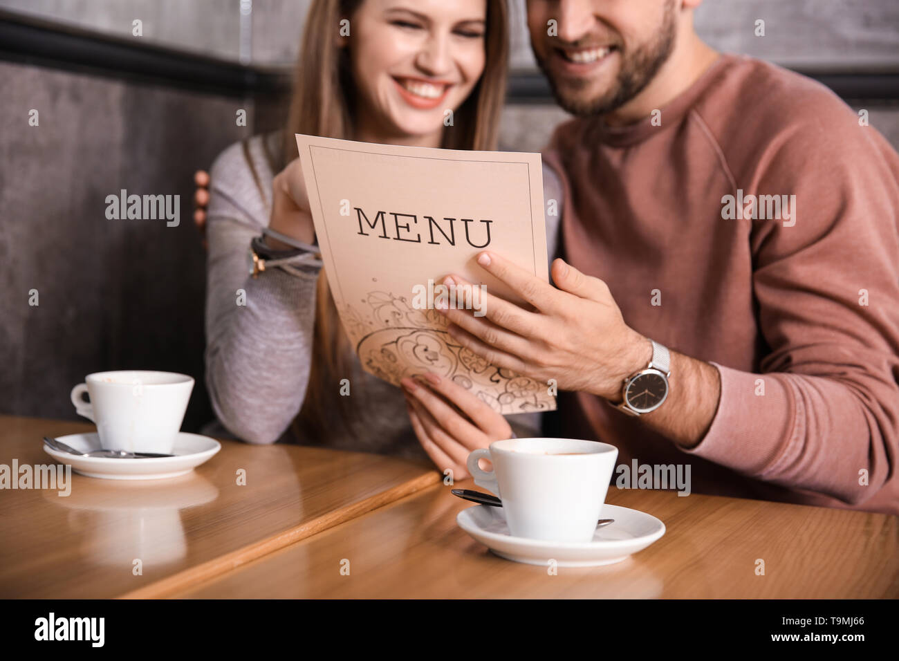 Dinner date looking at menu hi-res stock photography and images - Alamy