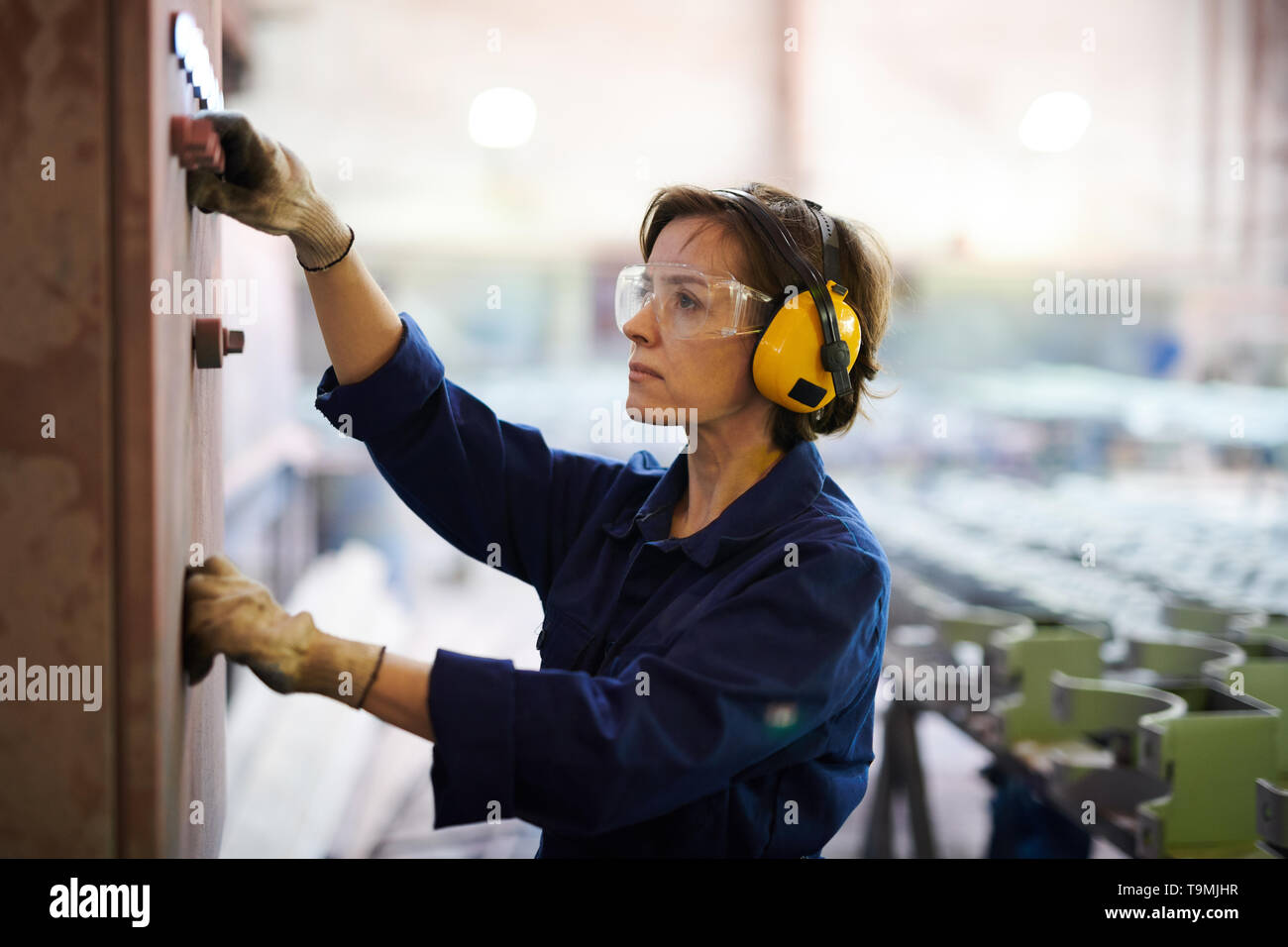 Woman Working at Factory Stock Photo - Alamy