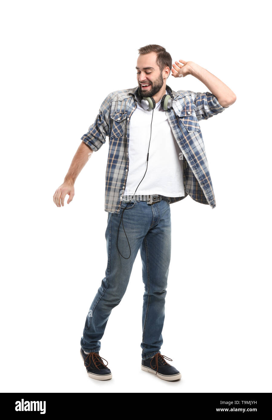 Handsome young man dancing on white background Stock Photo - Alamy